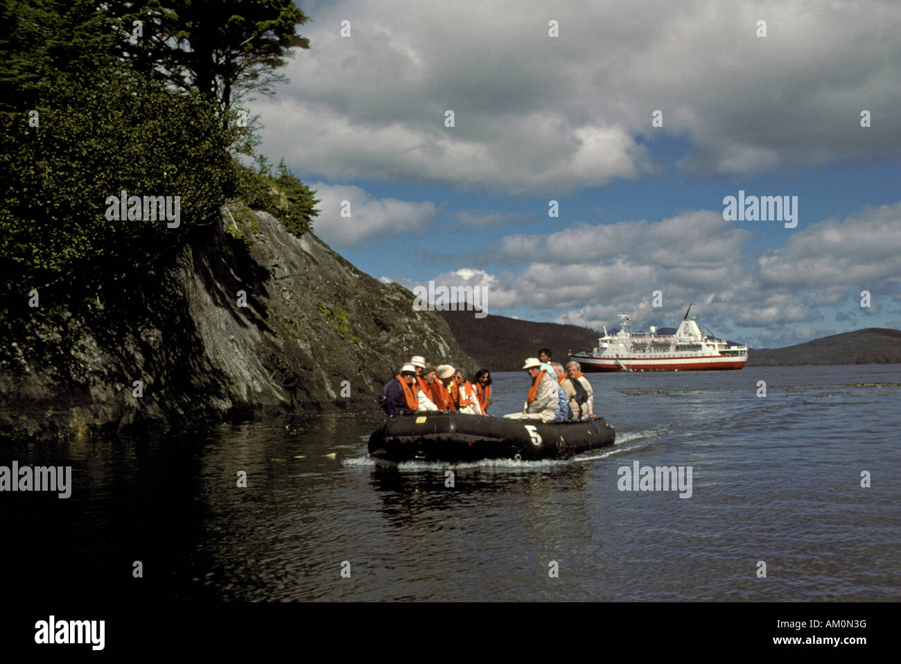 Society Explorer cruise ship passengers exploring in Canadian fjords ...