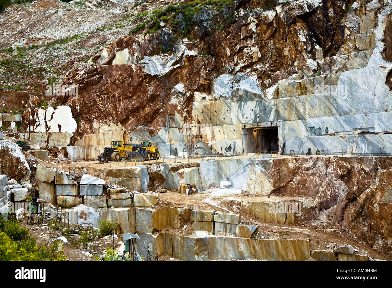 Mechanical shovel excavator in the marble stone pit of Carrara Tuscany ...