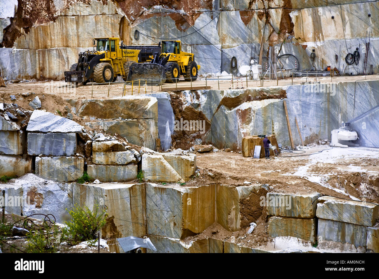 Mechanical shovel excavator in the marble stone pit of Carrara Tuscany ...