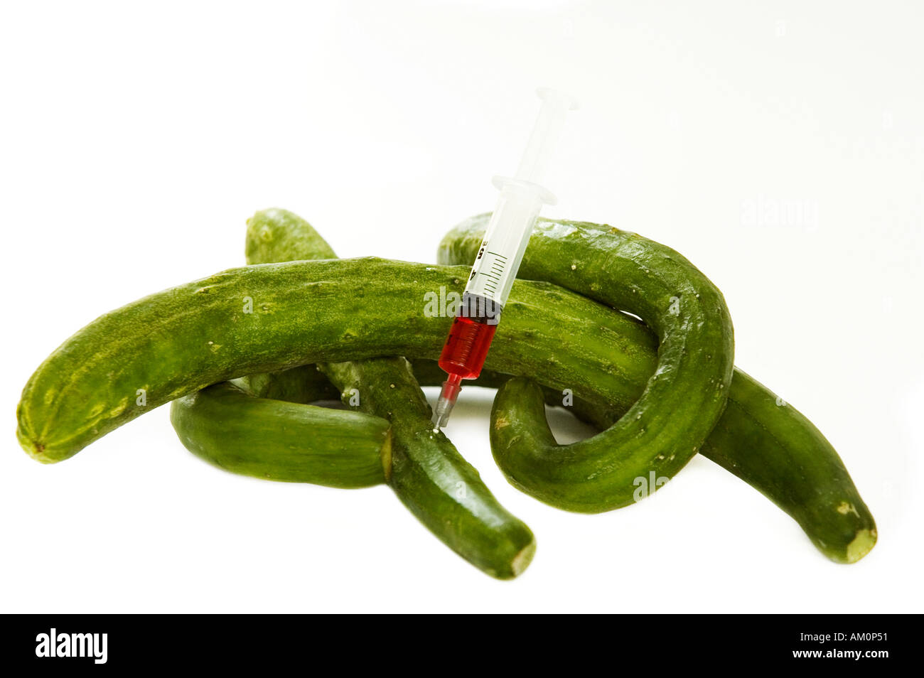 syringe in green cucumbers gm ogm food genetic modificarion genetically ...