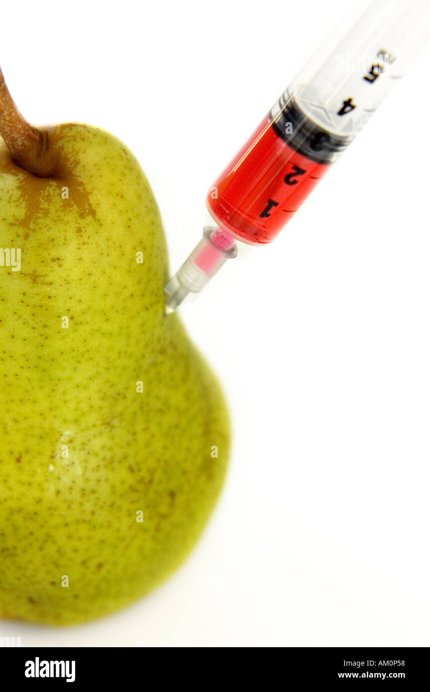 syringe in green pear gm ogm food genetic modificarion genetically ...