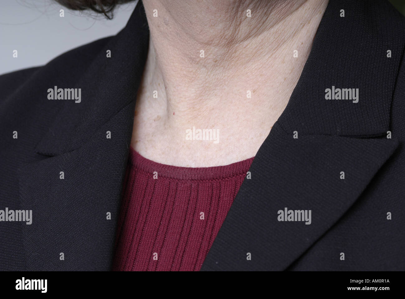 A woman messaging a sore spot on her body Stock Photo - Alamy