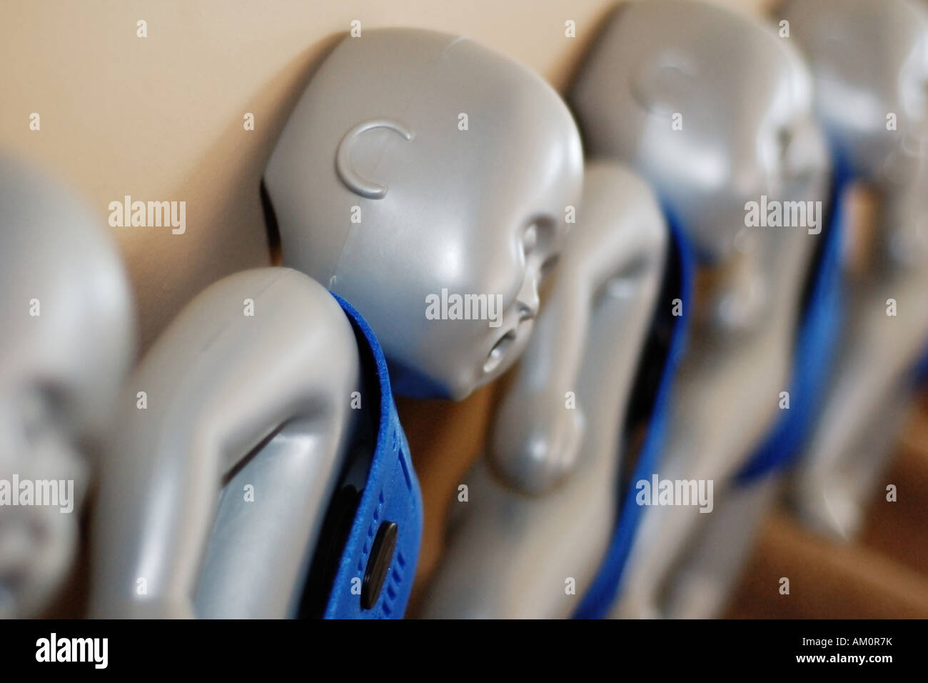 First aid dolls lined up on stairway Stock Photo - Alamy