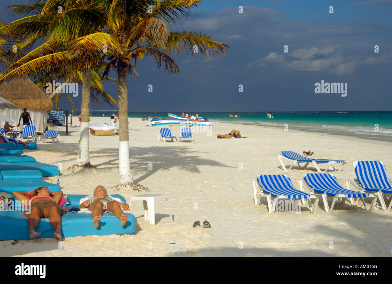 Sunbathers on Tulum Beach Stock Photo - Alamy