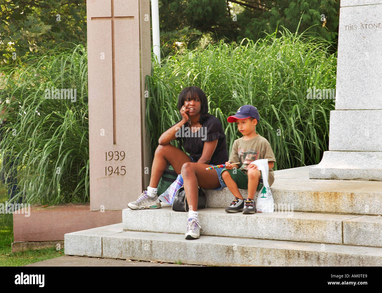 Mother and son taking a break at Niagara Falls, Canada, during a family ...