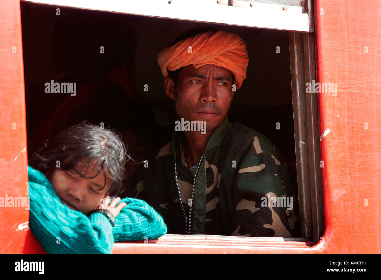 Burmese man and woman at a train window, Kalaw railway station, Shan ...