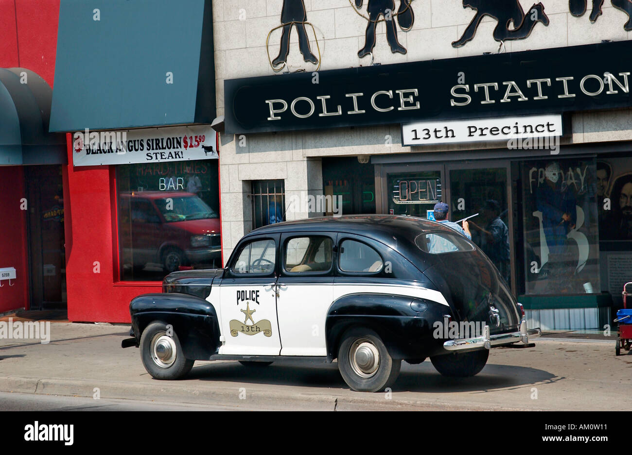 Vintage police car displayed outside an old police station at the ...