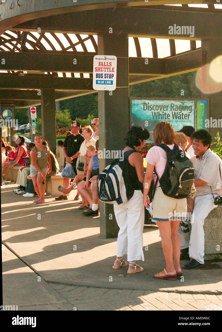 Tourists waiting for a bus at Niagara Falls, Canada Stock Photo - Alamy