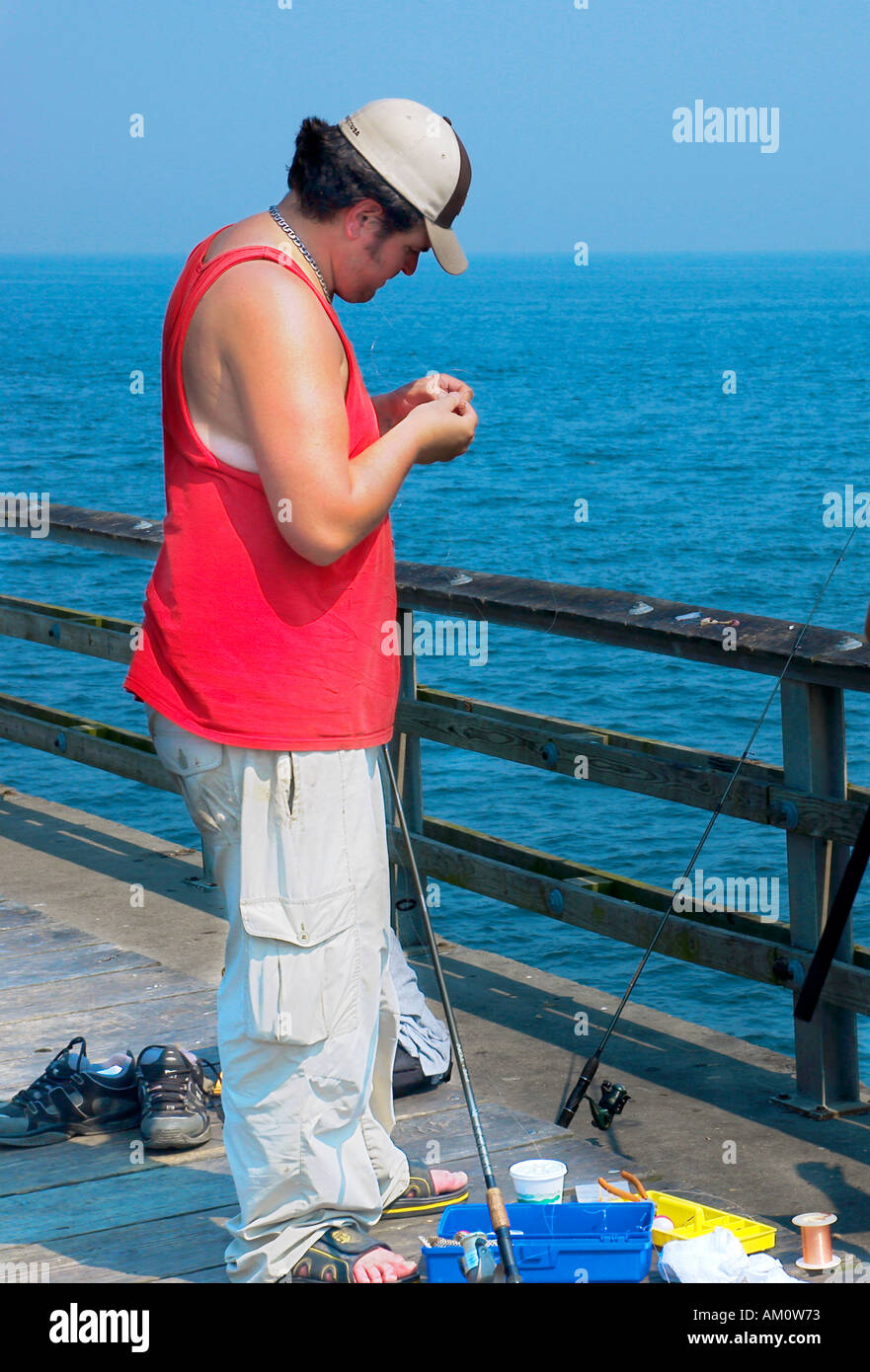 Caucasian man baiting a fishing hook at Chesapeake Bay, USA Stock Photo ...