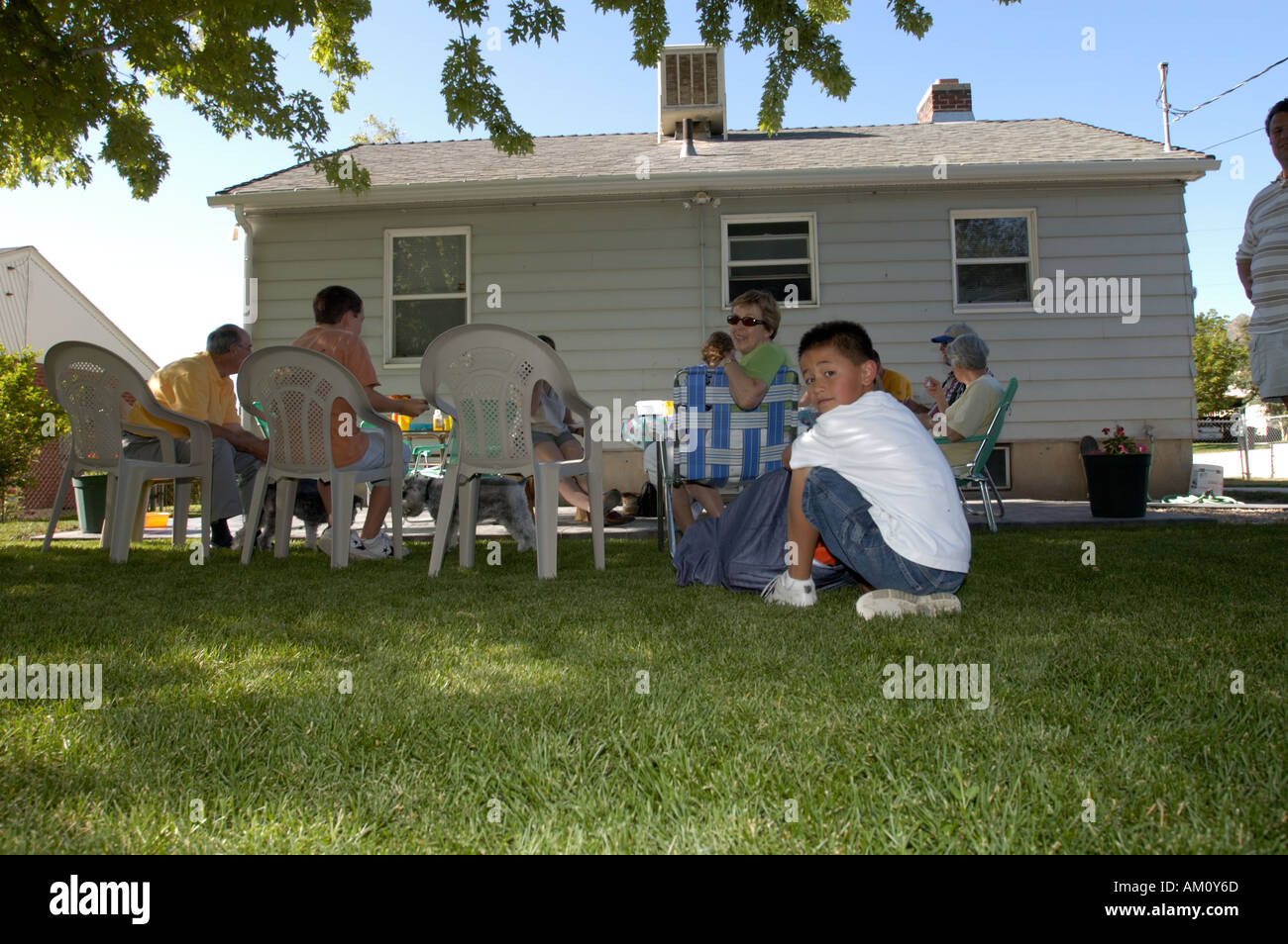 Family gathering outside for a picnic Stock Photo - Alamy