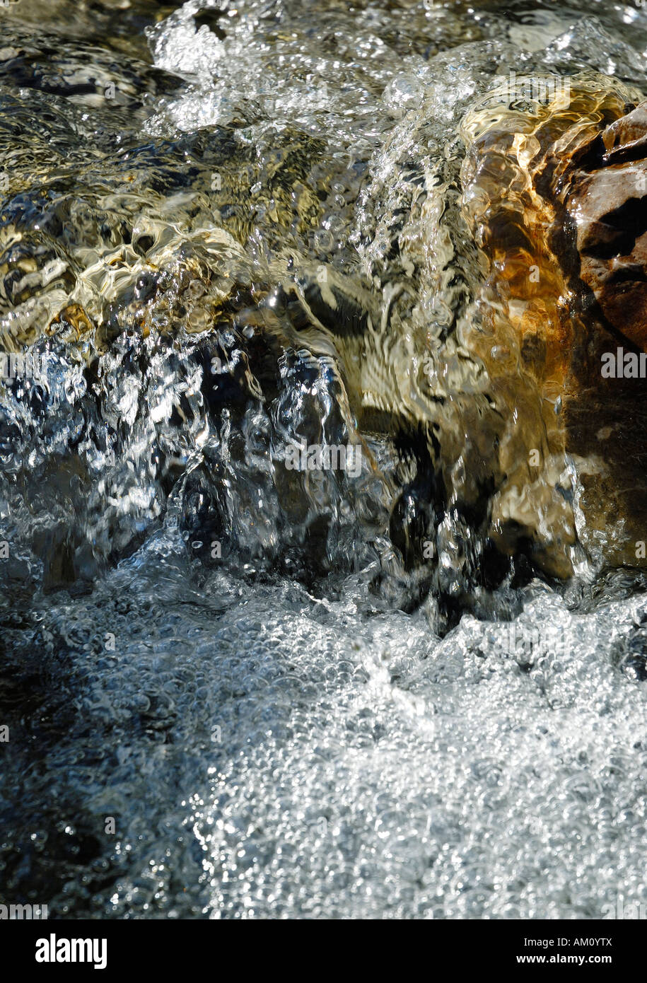 Sparkling air bubbles generated in cascade of mountainous river Stock ...