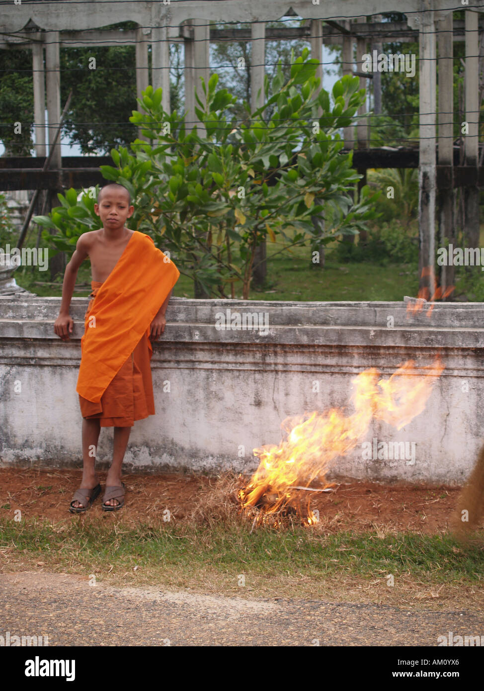 Monk and Fire Stock Photo - Alamy
