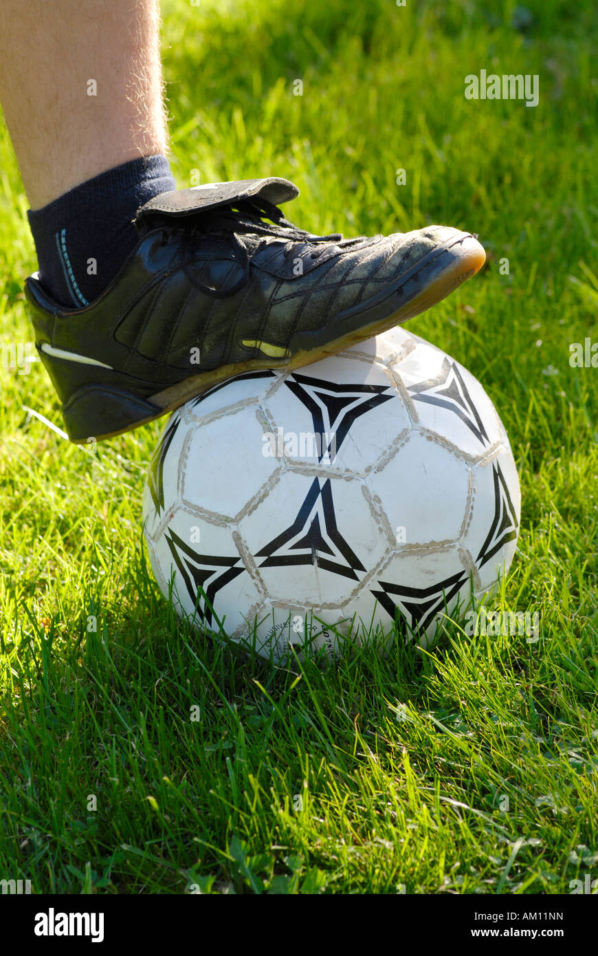 Foot and football Stock Photo - Alamy
