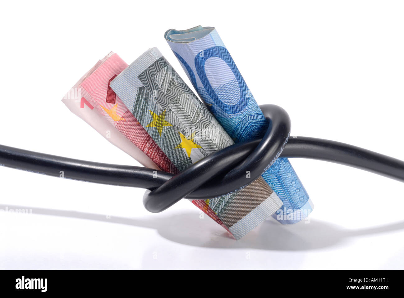 Bills in the knot of a power cable Stock Photo - Alamy
