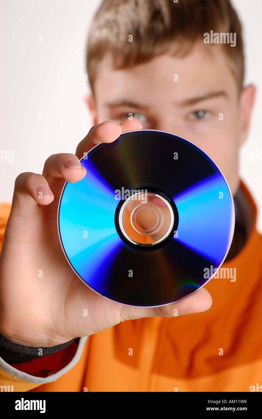 Teenager holding a CD Stock Photo - Alamy