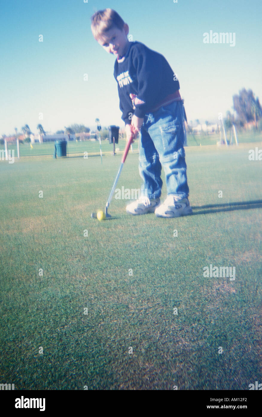 Boy Playing golf Stock Photo - Alamy