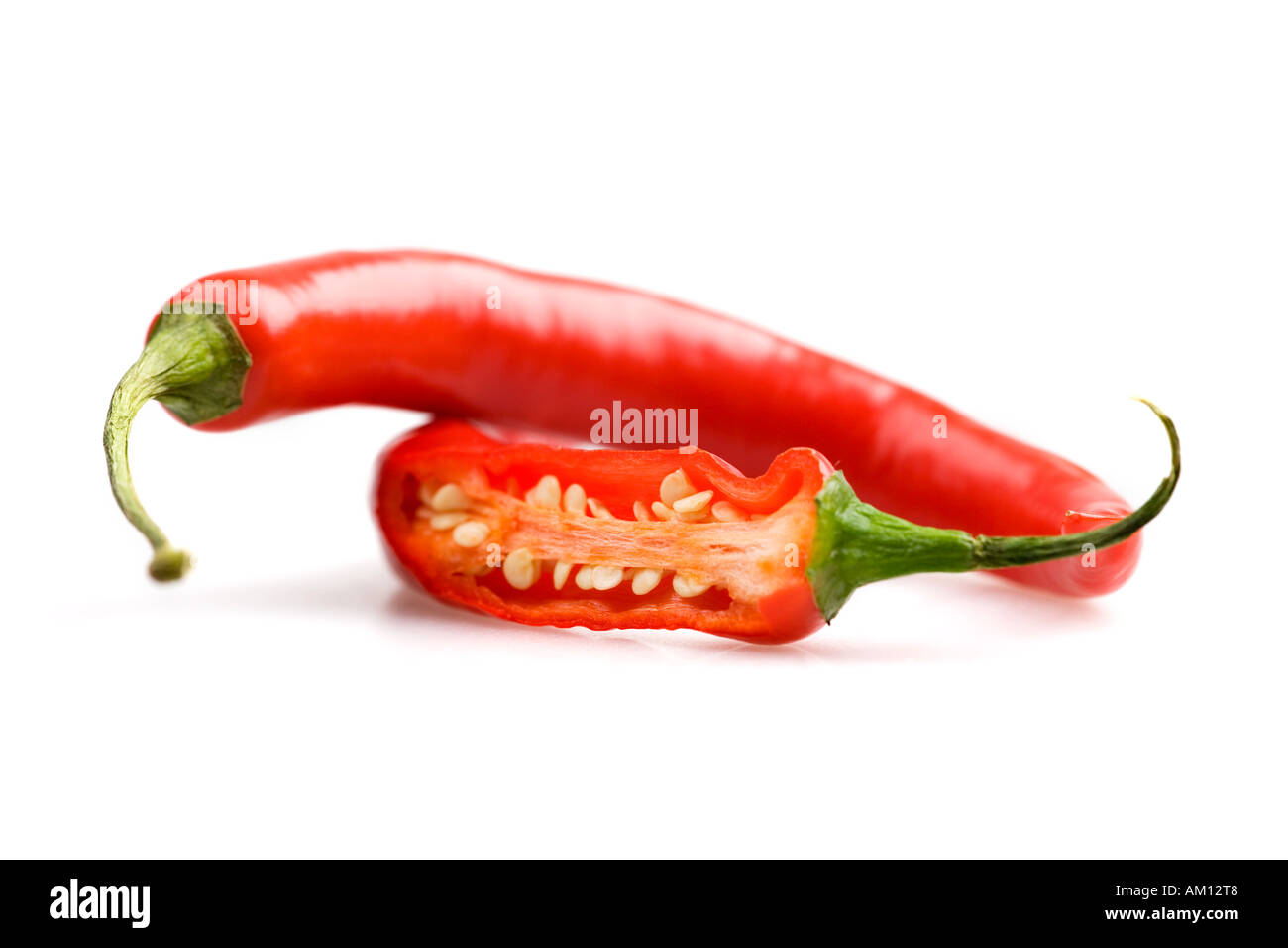 Hot red chilli sliced to show seeds Stock Photo - Alamy