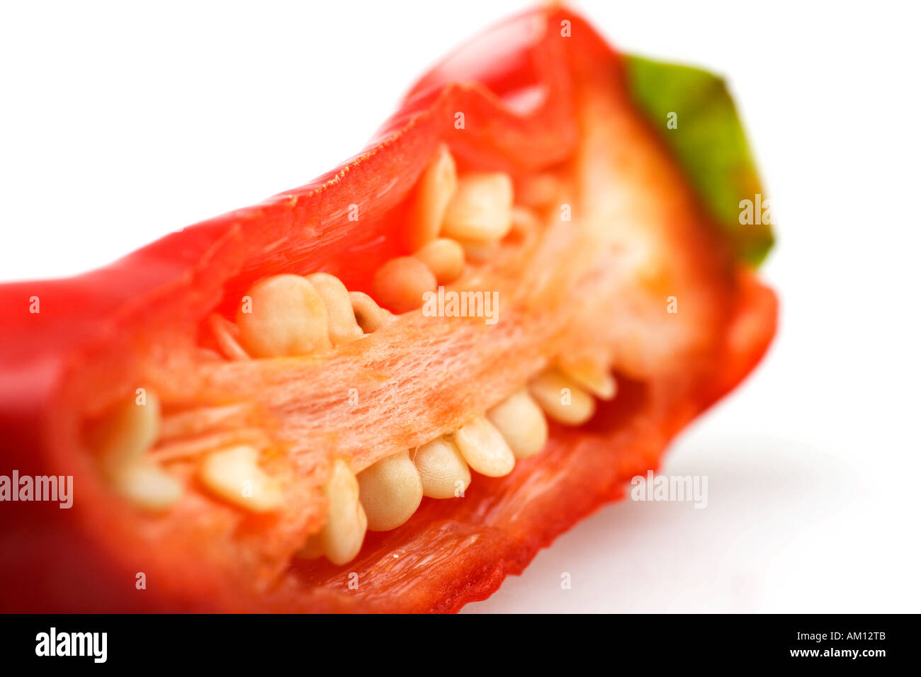 Hot red chilli sliced to show seeds Stock Photo - Alamy