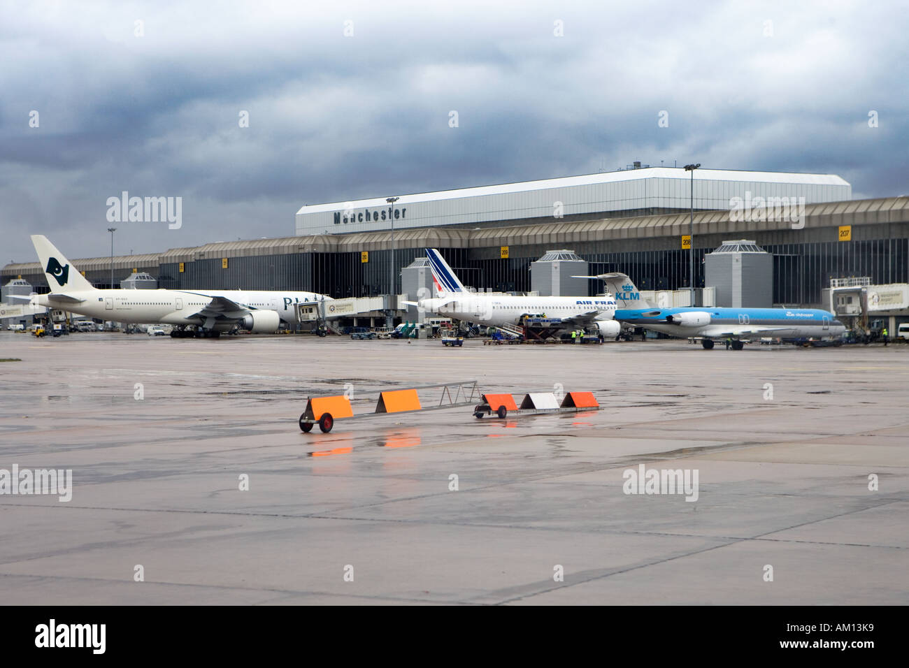 Three large aircraft parked at Airport terminal Stock Photo - Alamy