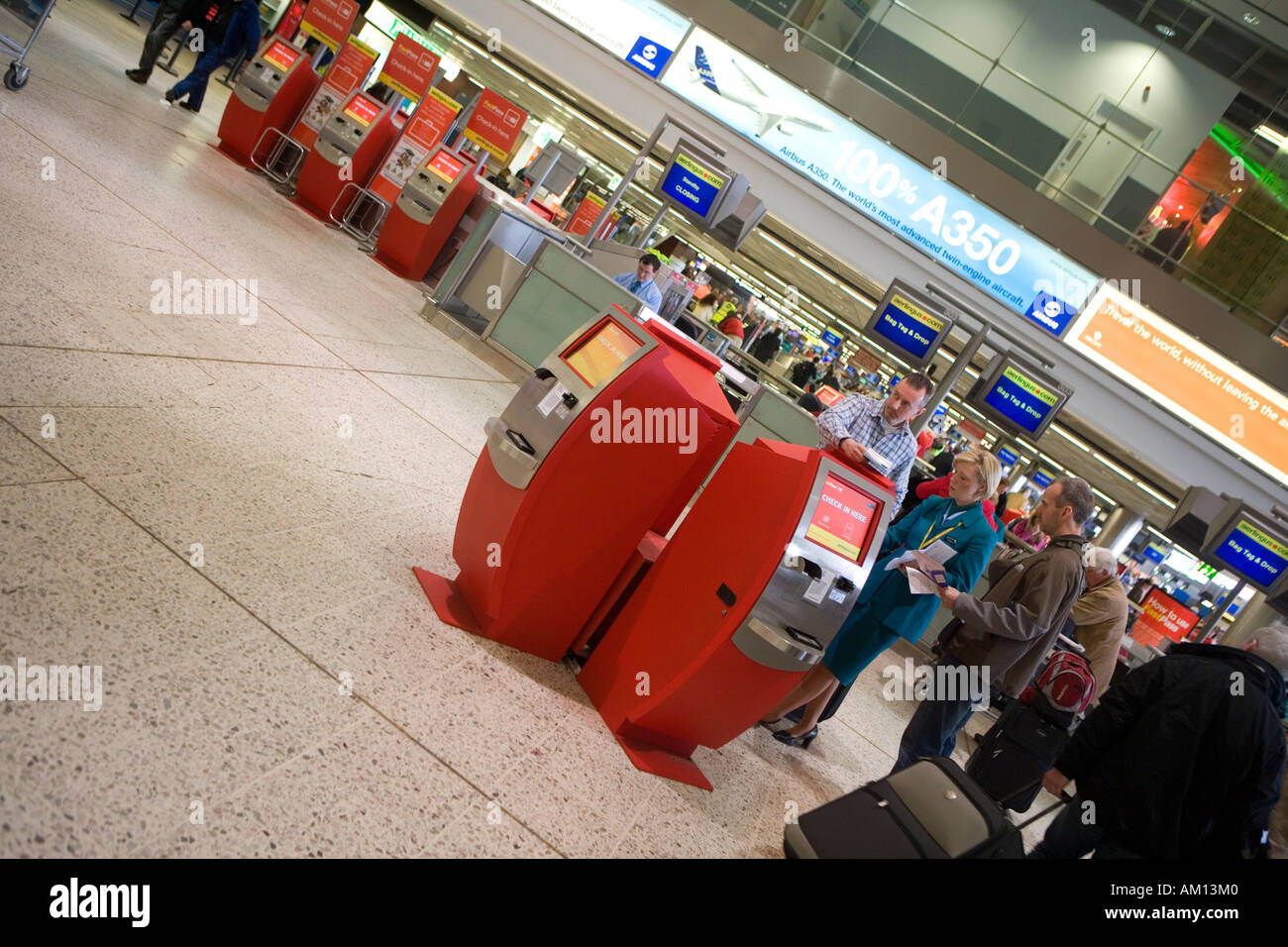 Busy international Airport check-in terminal Stock Photo - Alamy