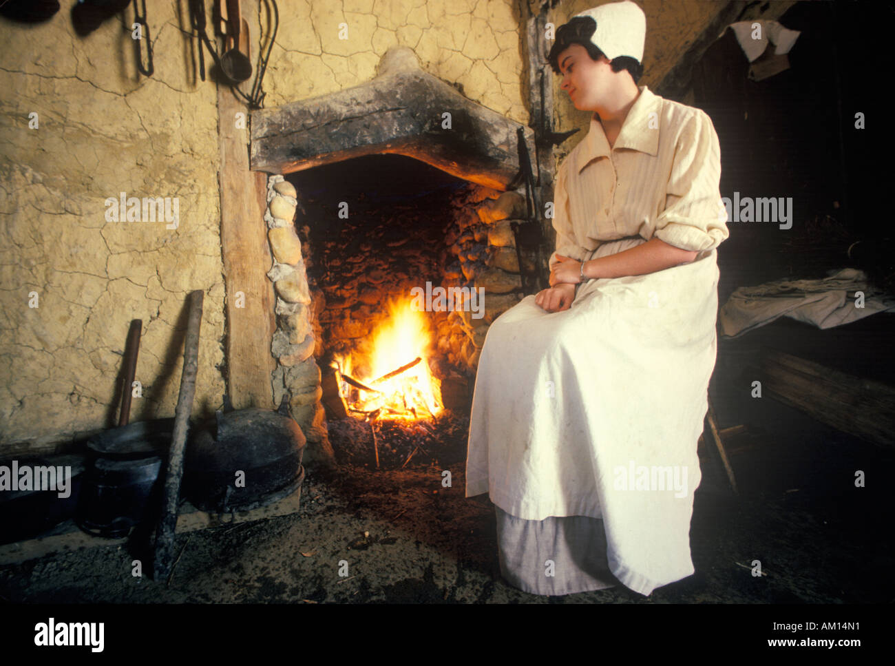 Participant tending fire in historic Jamestown Virginia site of the ...