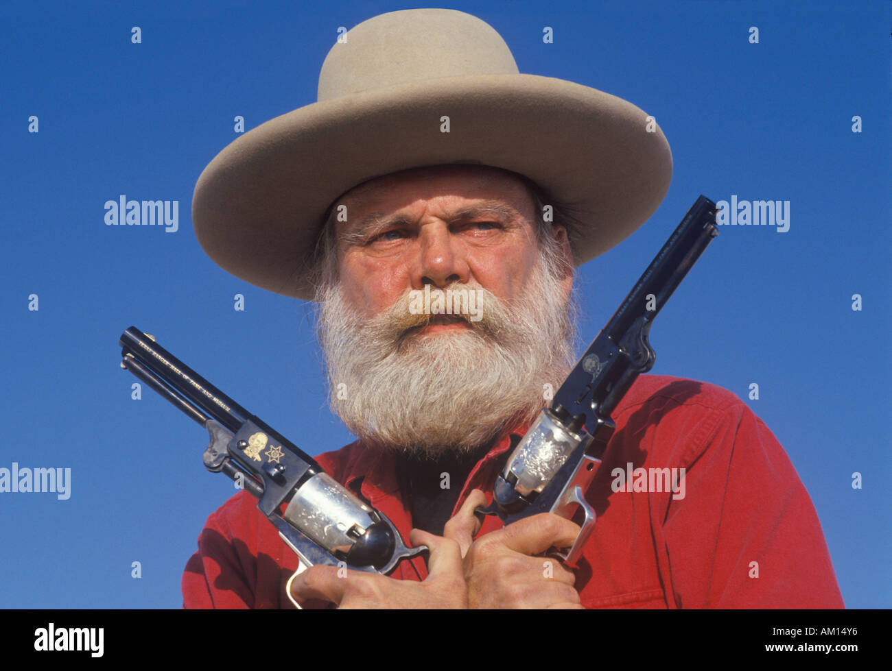 Old West gunslinger drawing guns during historical reenactment CA Stock ...