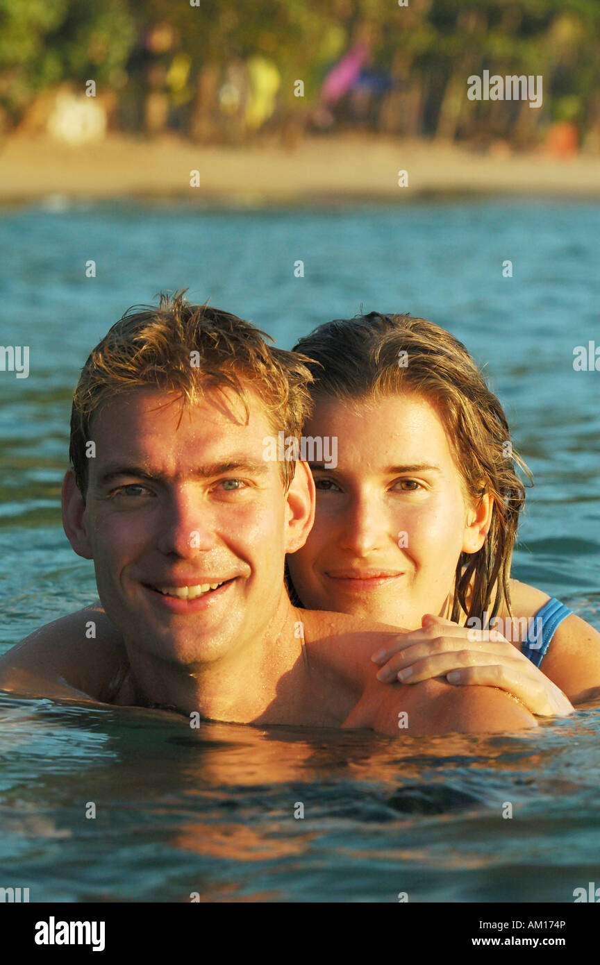 Young couple in the sea Stock Photo - Alamy