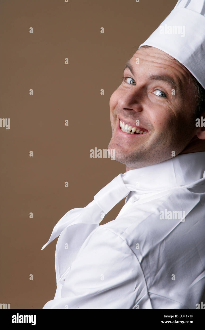 Smiling cook, looking over the shoulder Stock Photo - Alamy