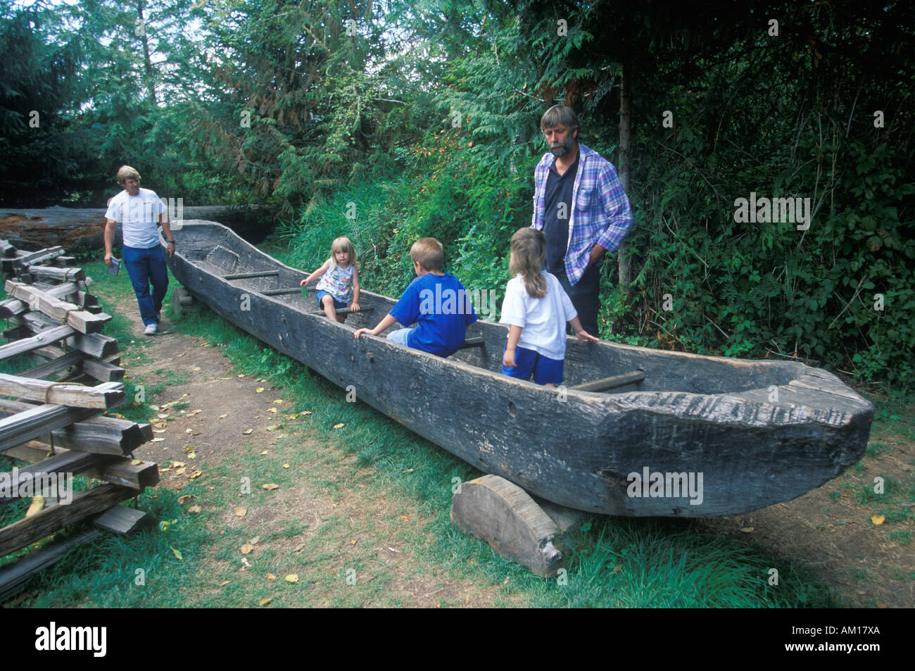 Tourists explore replica of dugout canoe at the Lewis and Clark ...