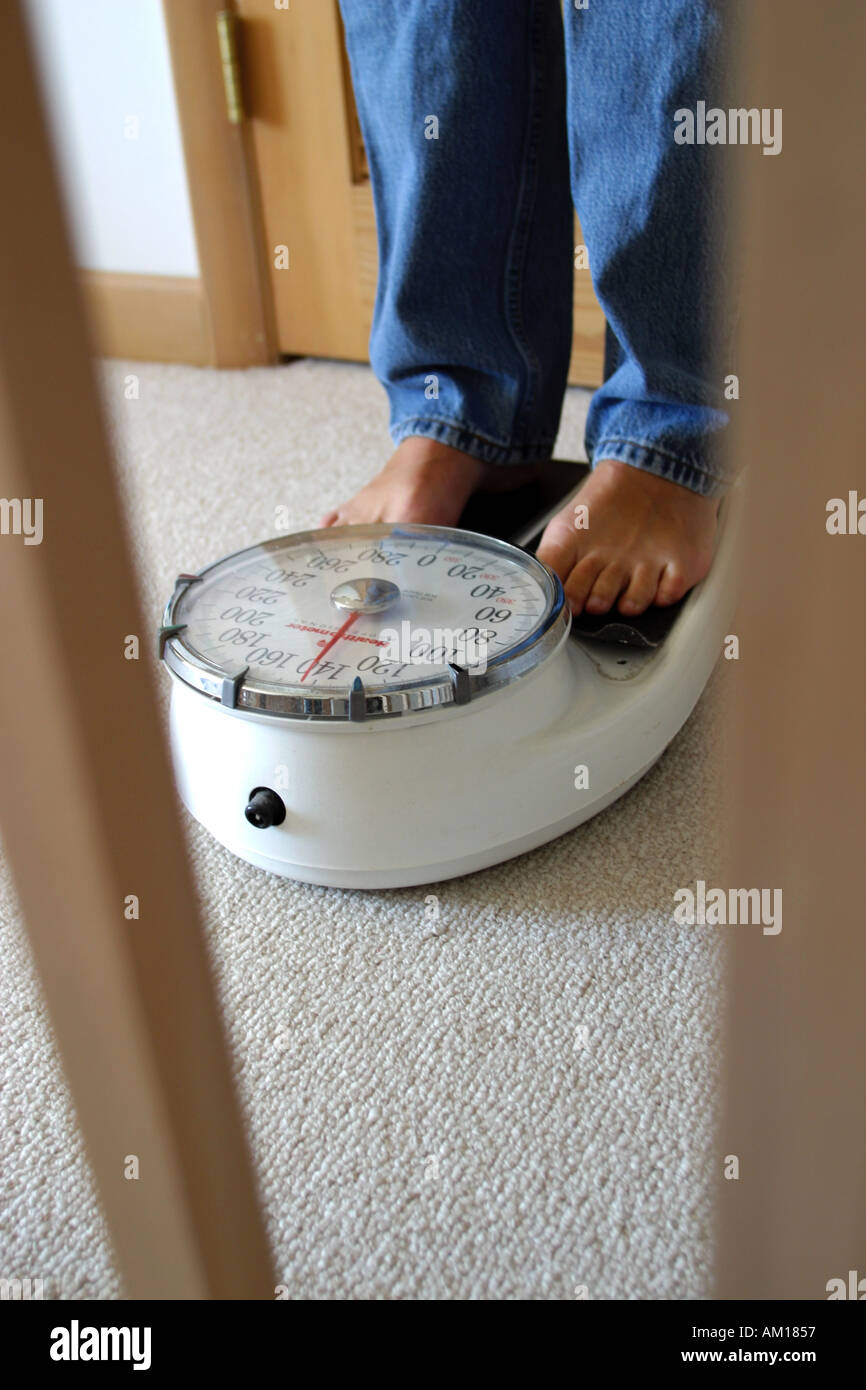 Woman on Scale Stock Photo - Alamy