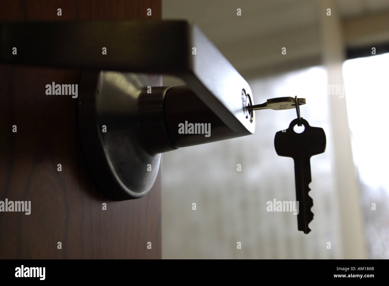 Key In Door to Office Stock Photo - Alamy