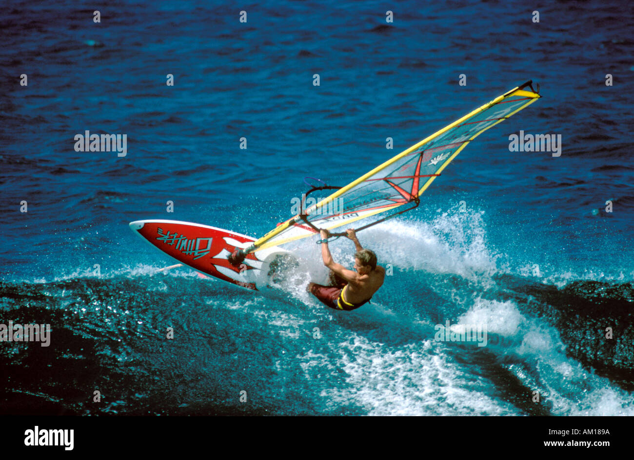 Male windsurfer on Ho Okipa Beach Maui Hawaii Stock Photo - Alamy