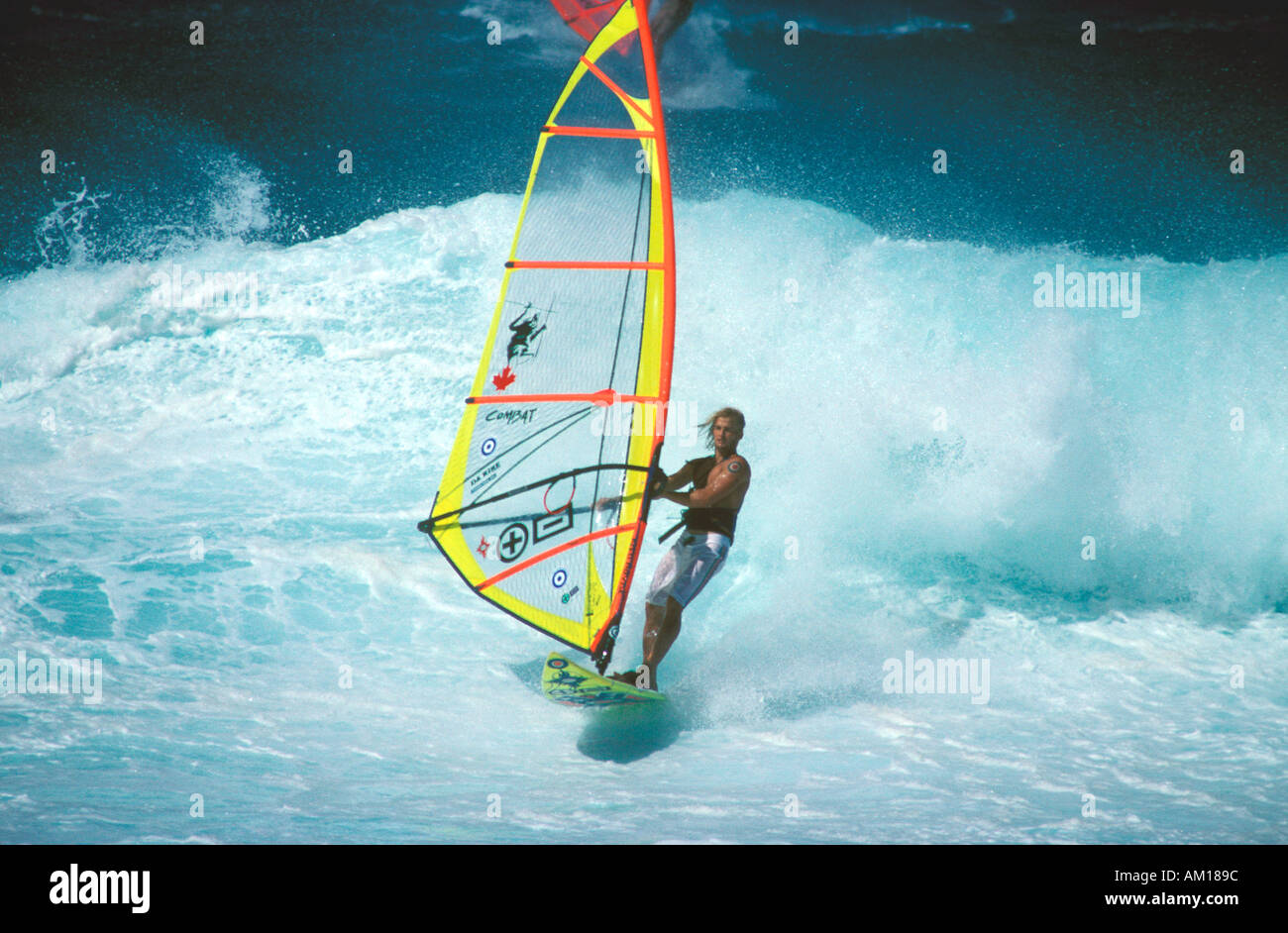 Jason Prior coming into shore windsurfing on H okipaBeach Maui Hawaii ...