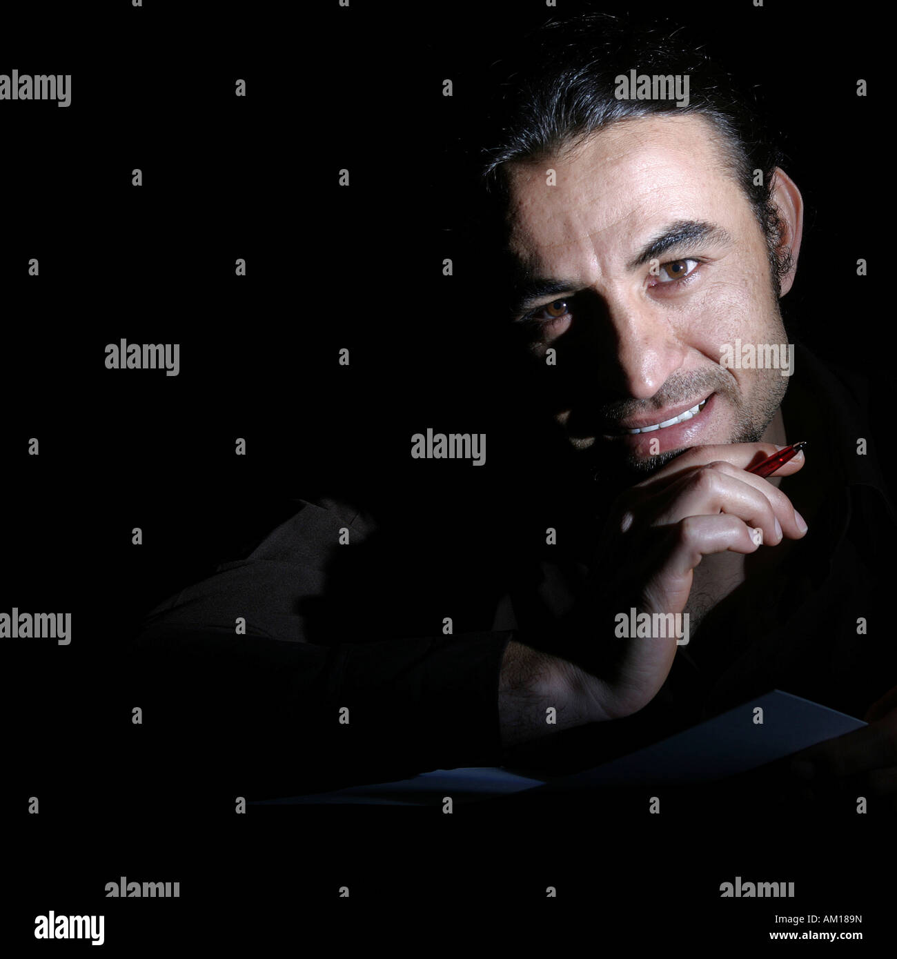 Man holding a pen Stock Photo - Alamy