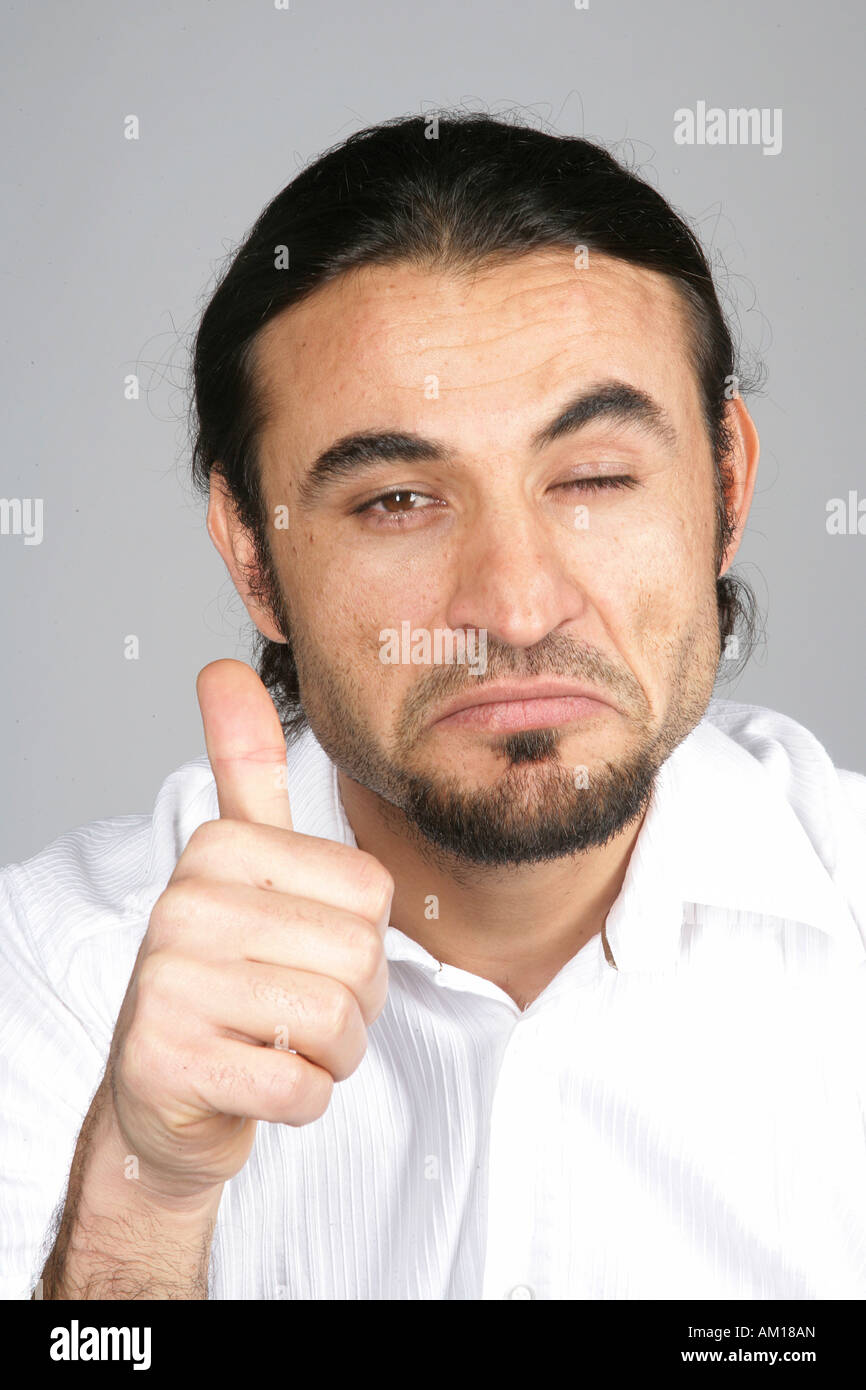 Portrait of a man, grimace, thumbs up Stock Photo - Alamy