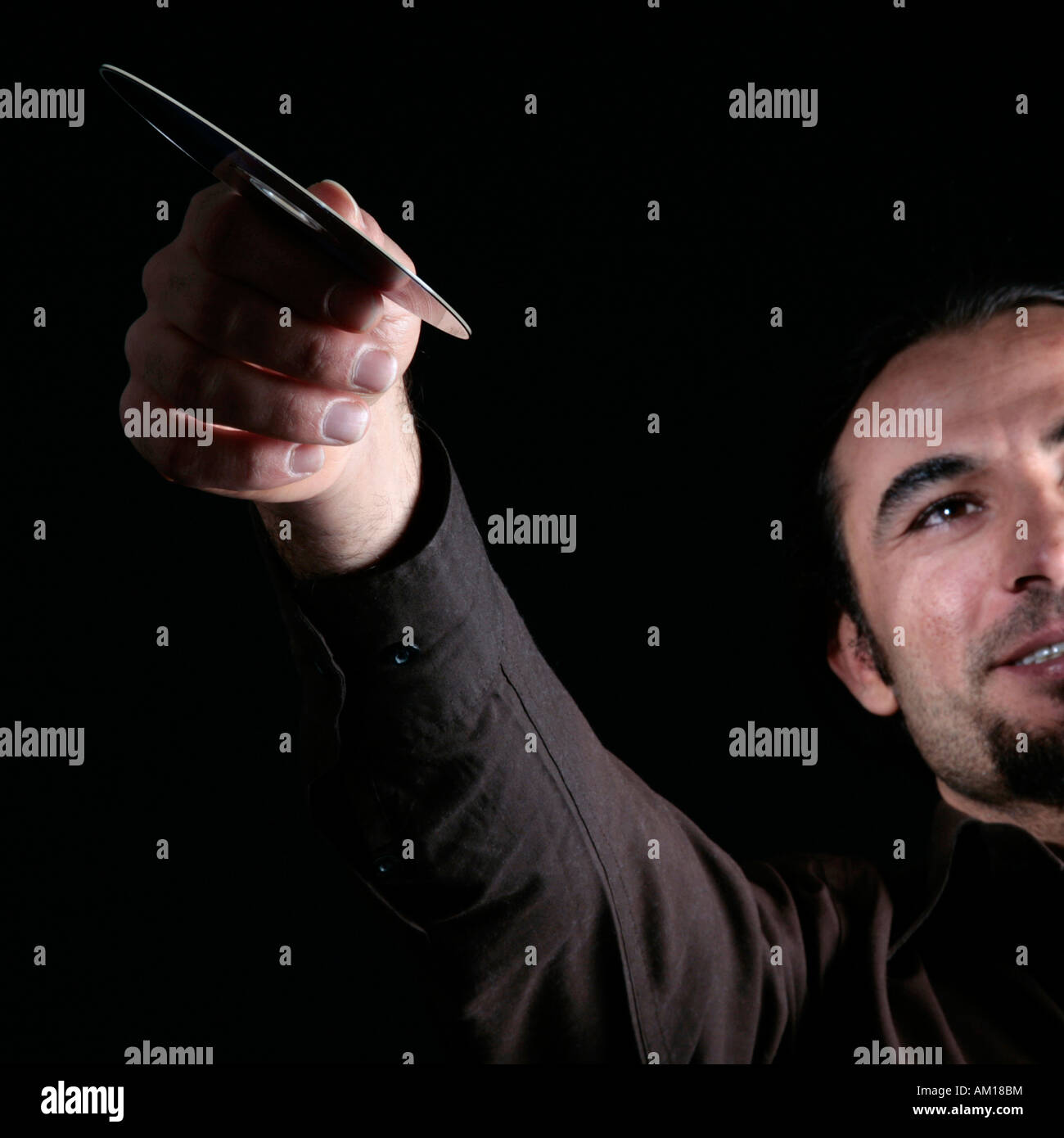 Man holding CD Stock Photo - Alamy