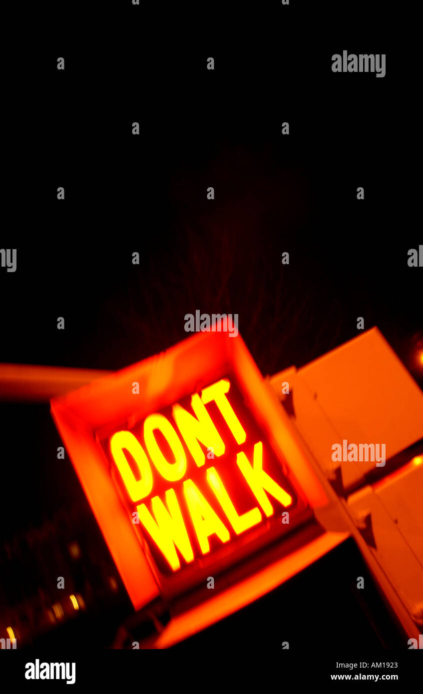 Vertical color image of a dont walk sign outside of a building on a ...