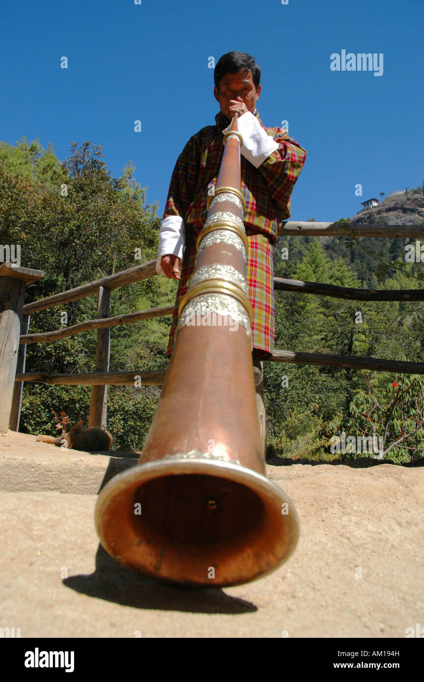 Buddhist monk blows horn, Paro valley, Bhutan Stock Photo - Alamy