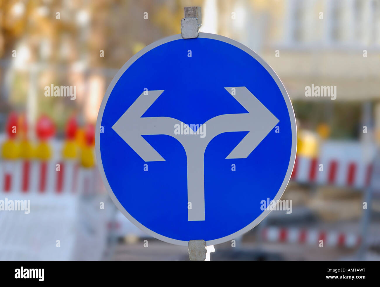 Traffic sign with two directional arrows in order to detour a road ...