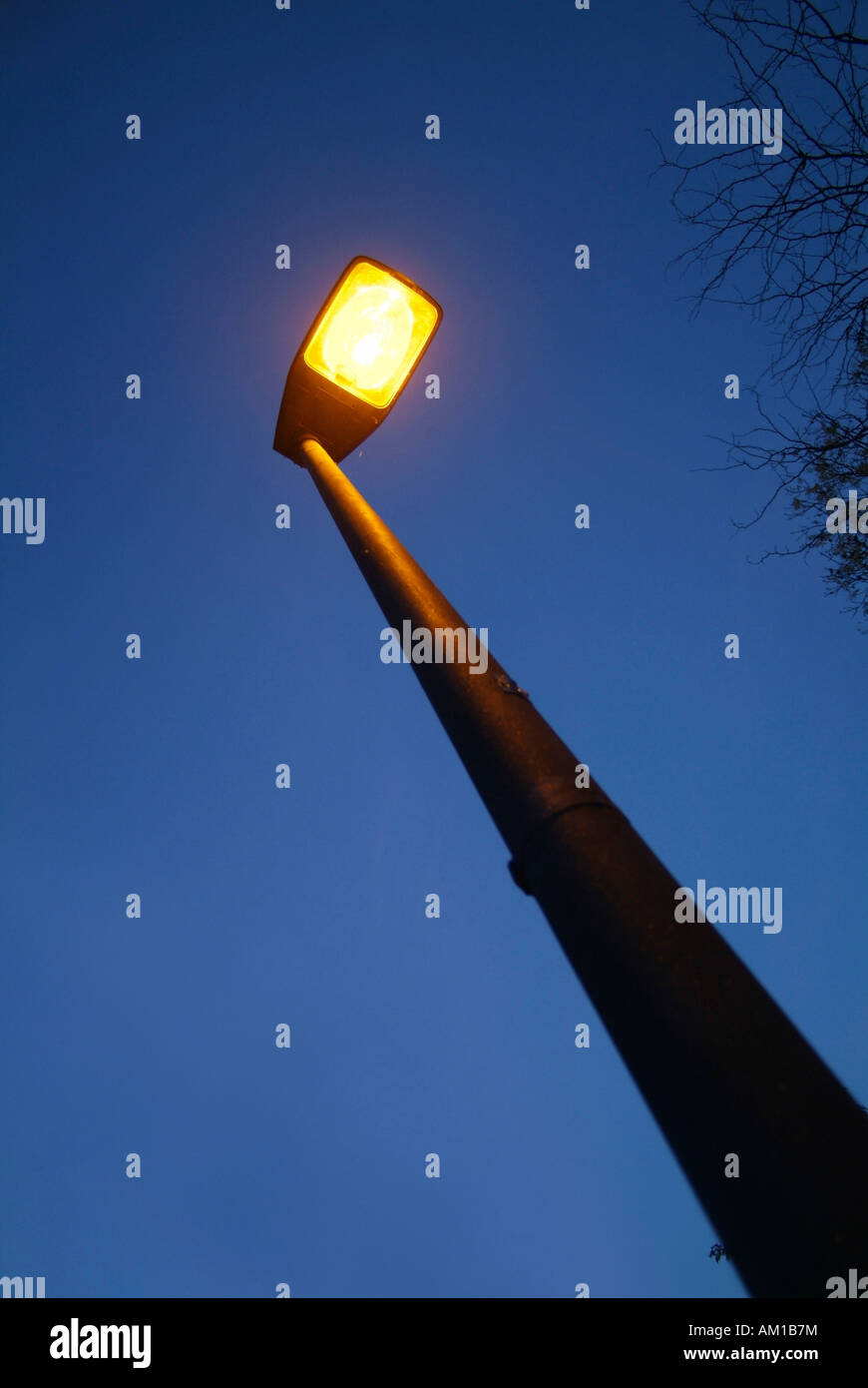 Lamp post in the dusk Stock Photo - Alamy