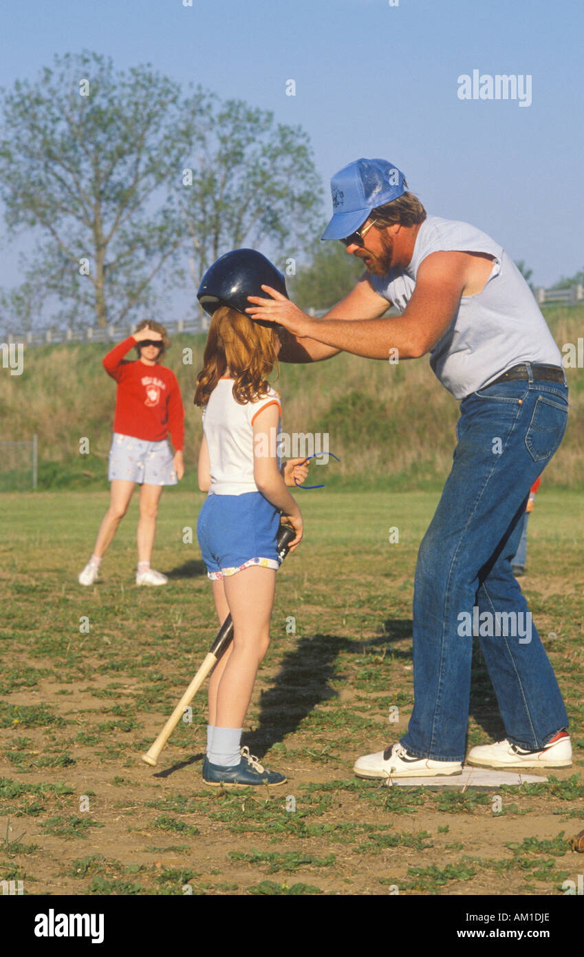 Parent coaching Girls baseball game in South Indiana Stock Photo - Alamy