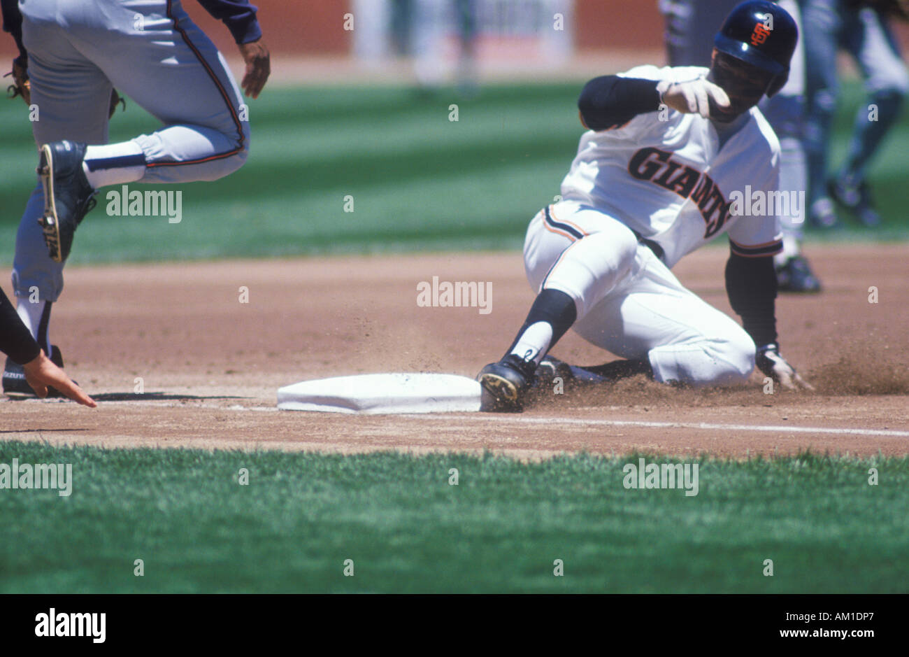 Professional Baseball player sliding into base during game Candlestick ...
