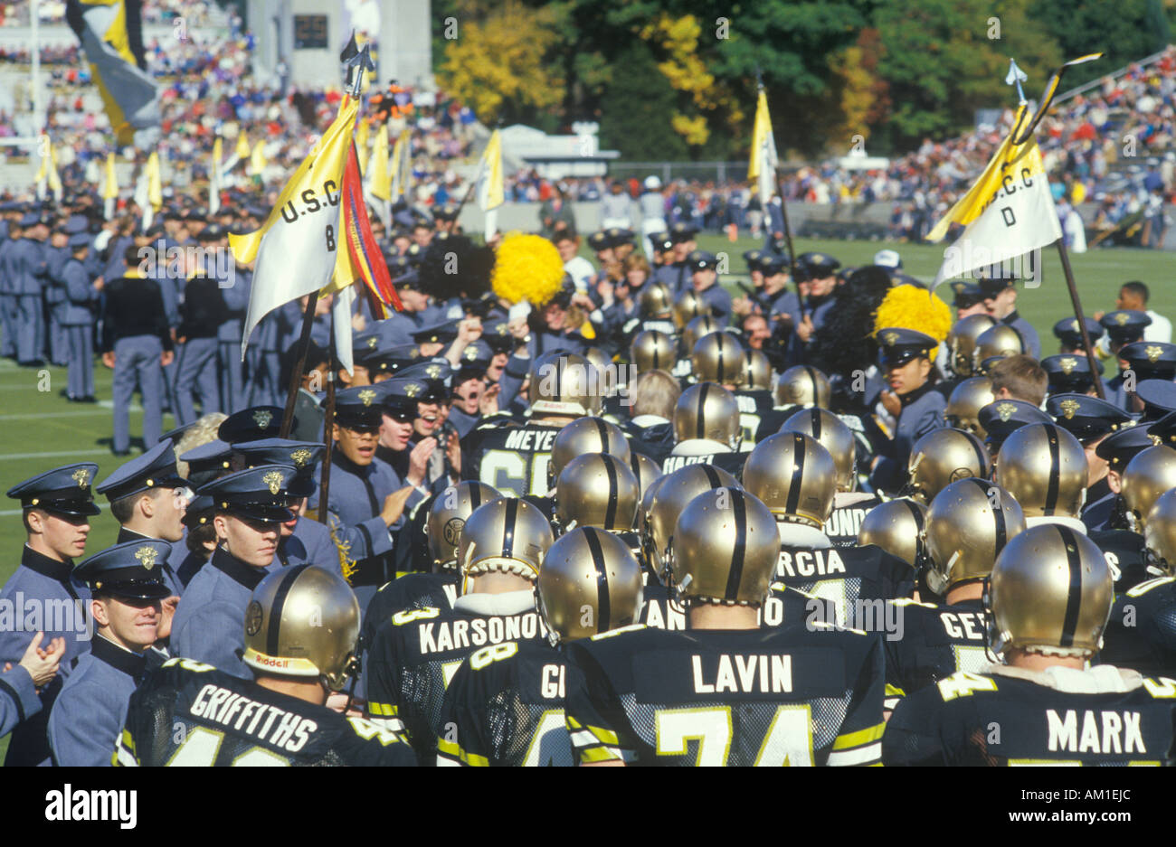 Parade of College football players flanked by West Point cadets West ...