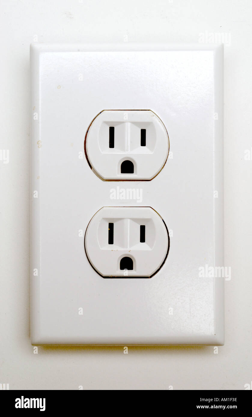 Vertical color image of a white electrical wall outlet Stock Photo - Alamy