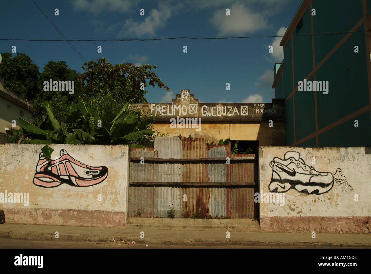 Nike and Adidas trainer graffiti on a wall with Political party Frelimo ...