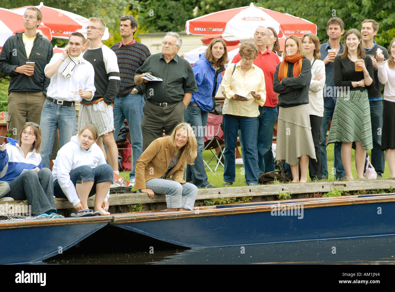 Spectators to the May Bumps in Cambridge watching the approaching boats ...