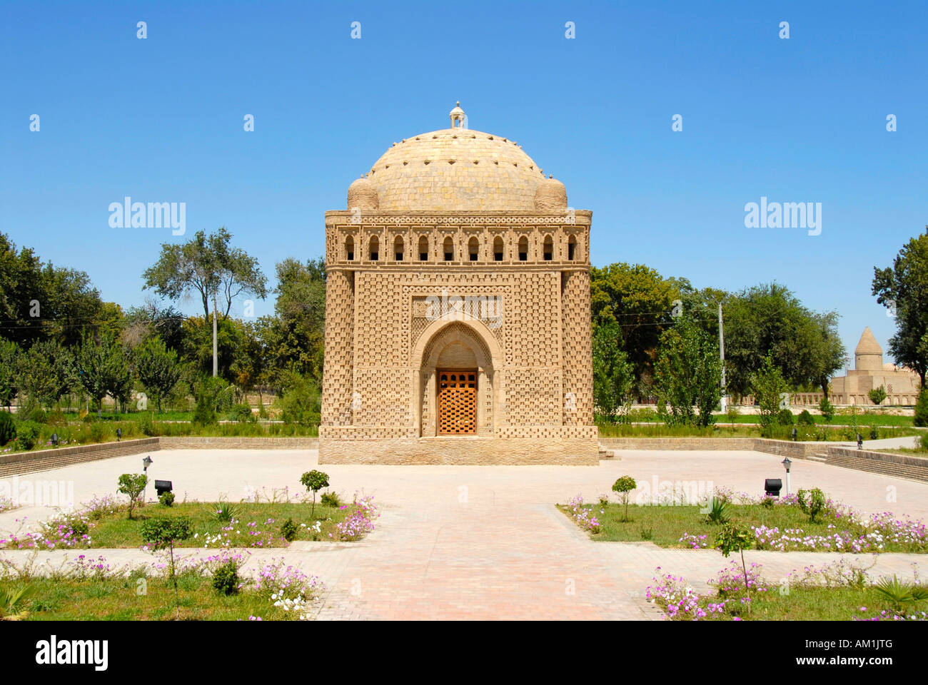 Old brick building Ismail Samani Mausoleum with Chashma-Ayub Mausoleum ...