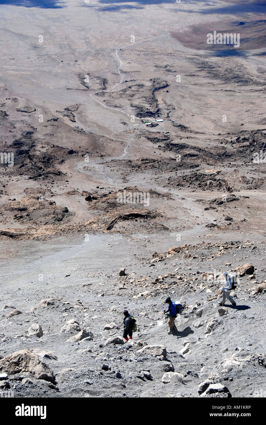 Group of mountaineers at dusty descent to Kibo Hut Marangu Route ...