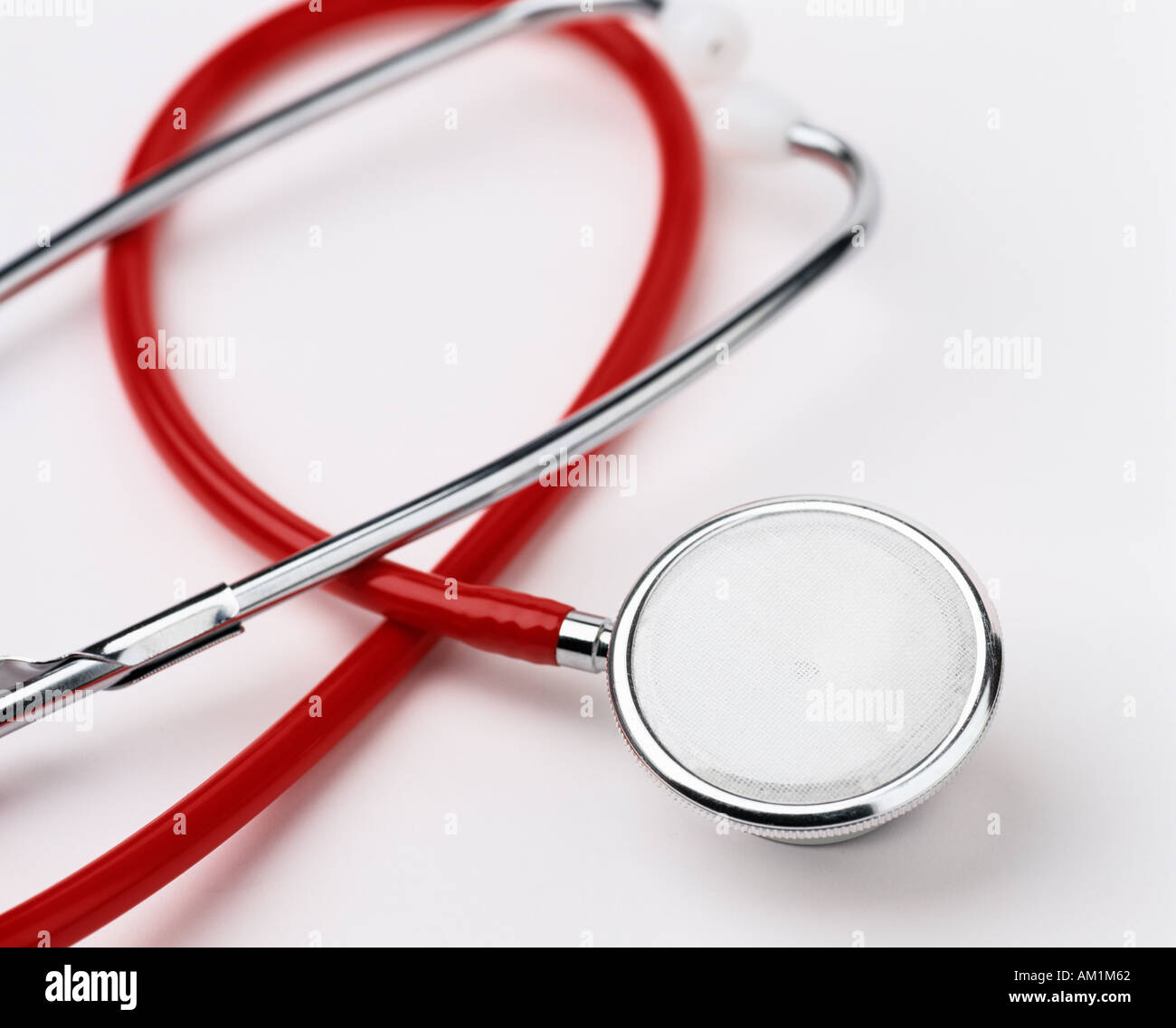 red stethoscope on a plain background Stock Photo - Alamy