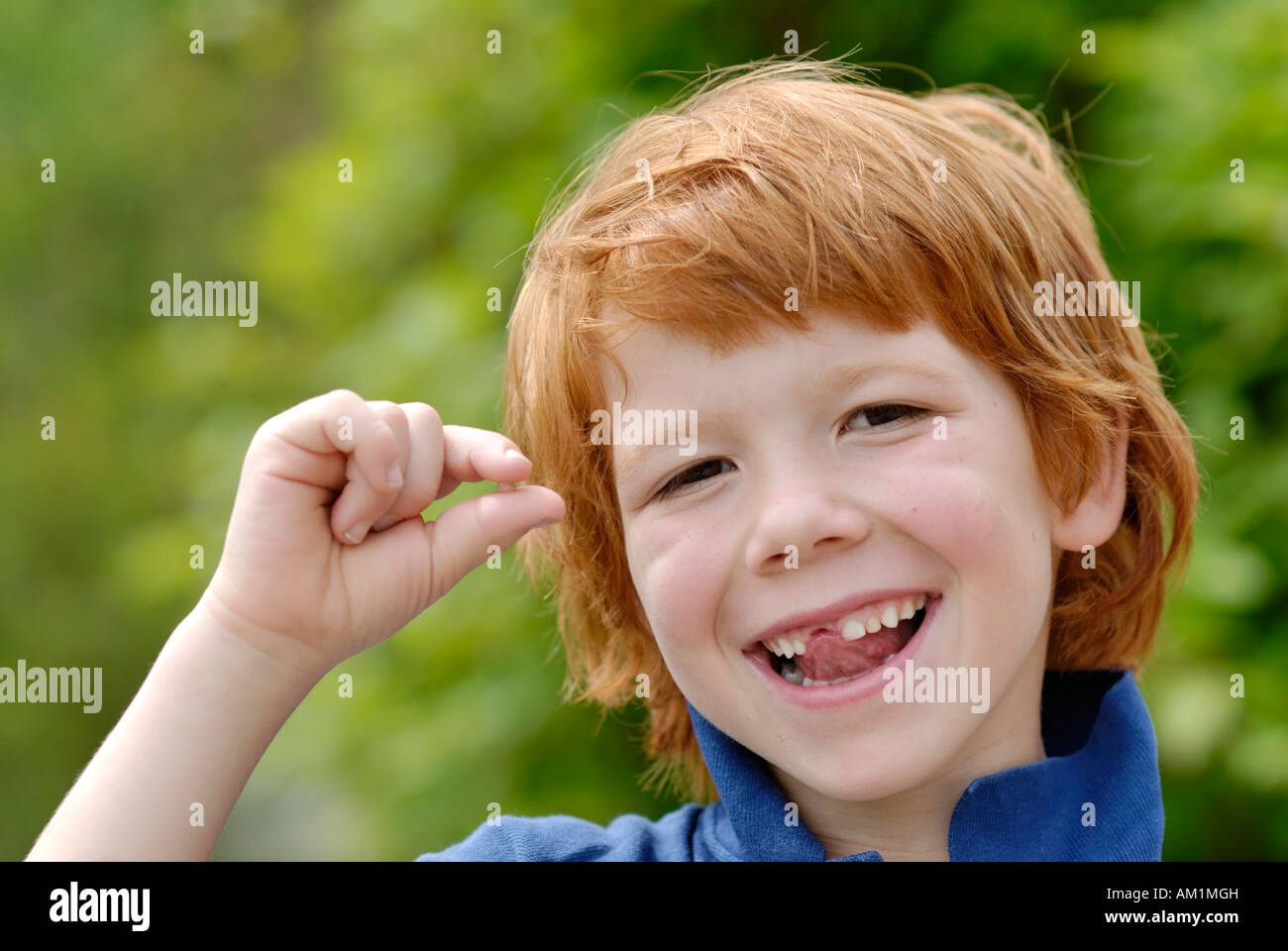 Boy with a tooth gap space losing his baby teeth deciduous milk teeth Stock Photo - Alamy